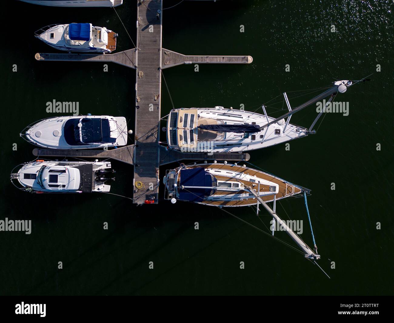 Aerial top view of a yacht marina by the sea, adorned with elegant ...