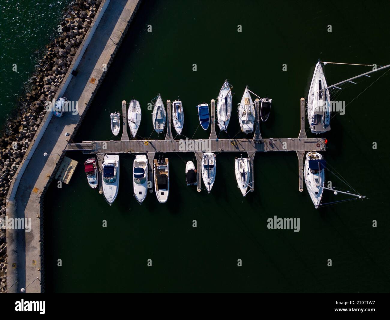 Aerial top view of a yacht marina by the sea, adorned with elegant ...