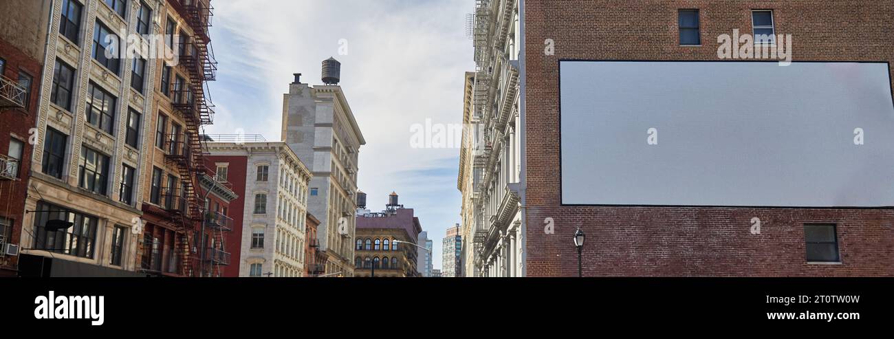 vacant billboard with empty advertising space on building of downtown ...