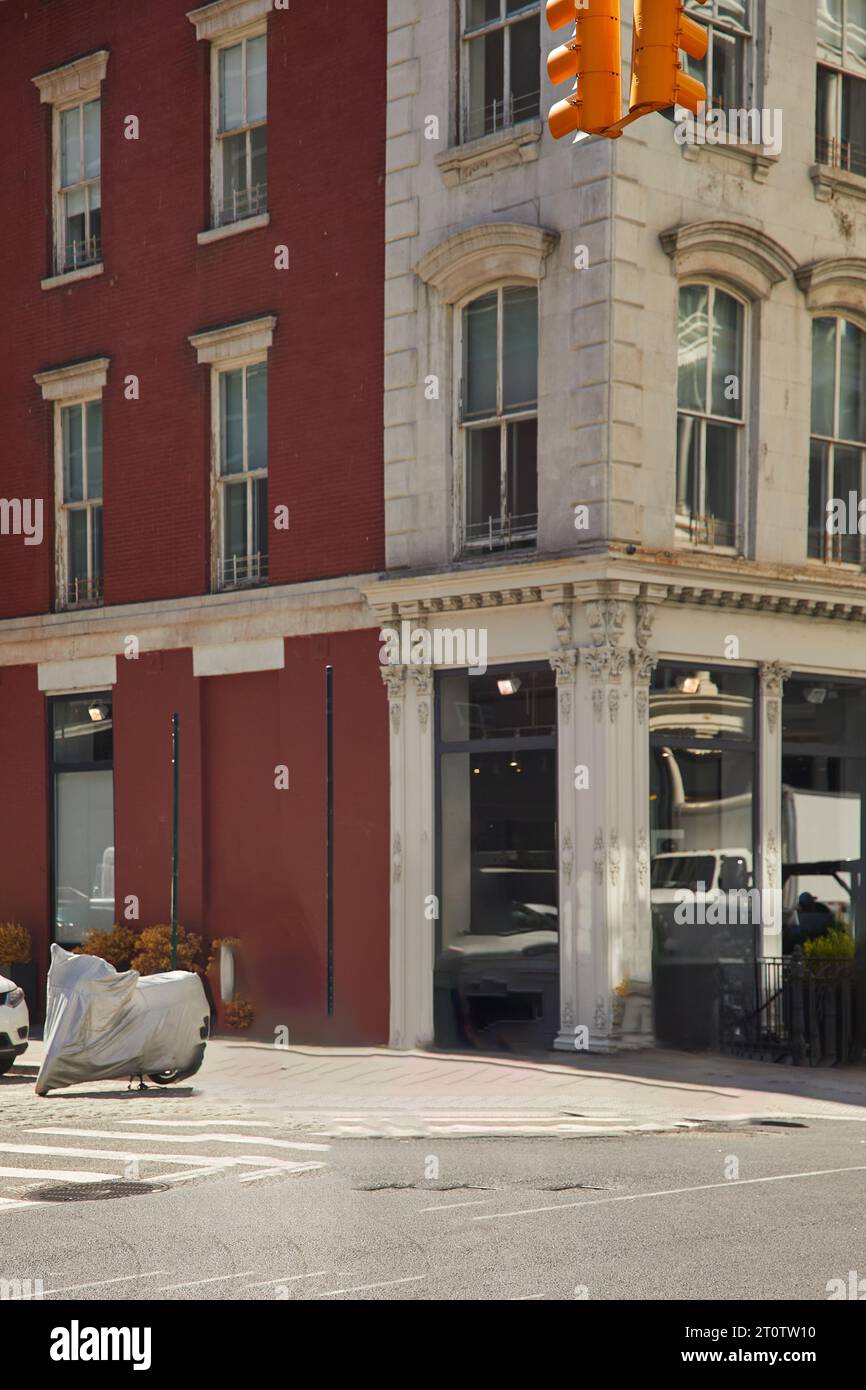 traffic light and corner of building on urban crossroad in downtown of ...