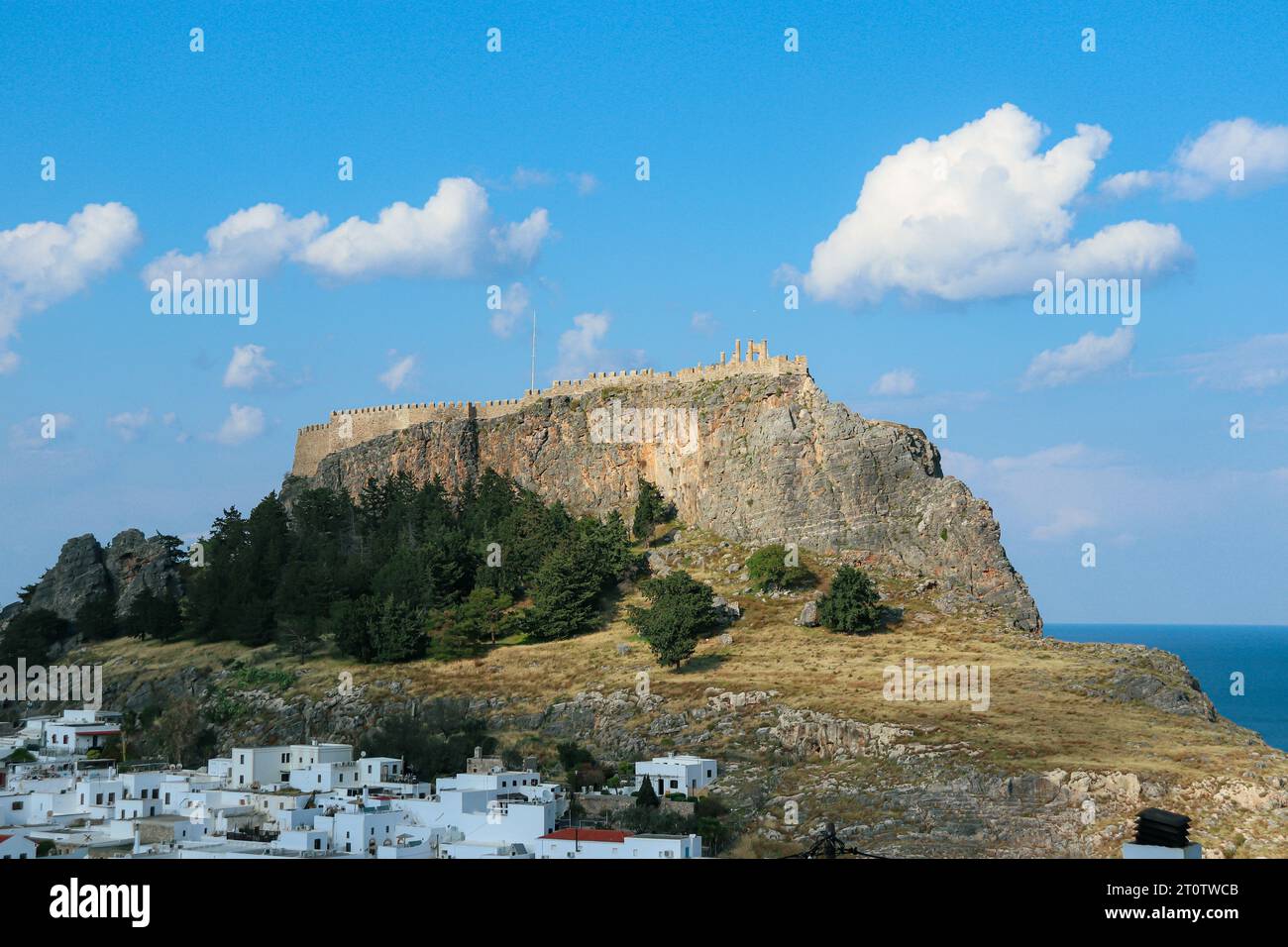 View from Lindos of the Acropolis of Lindos fortress on top of a ...