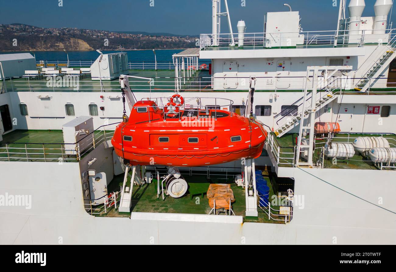 lifeboat on a ferry, which is a crucial safety measure for emergency ...