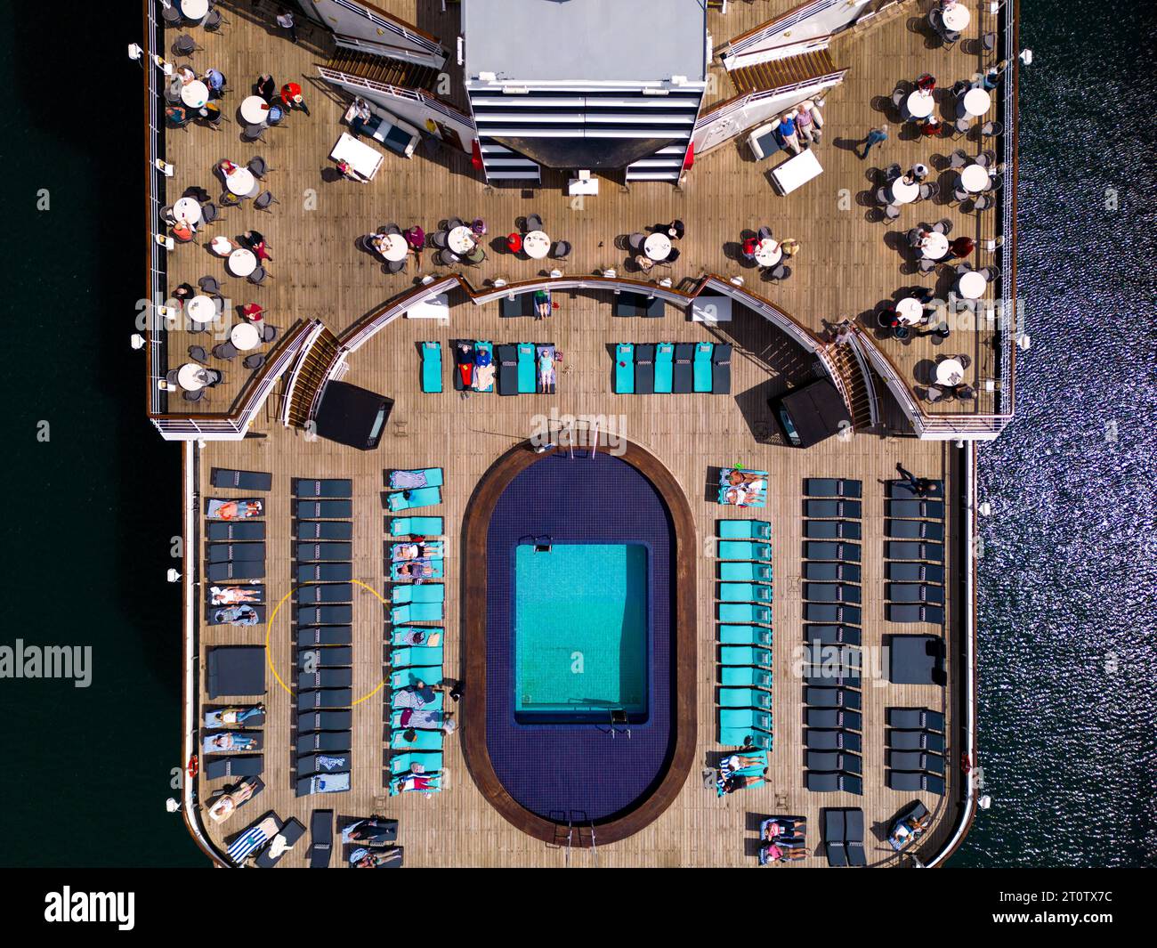 Taking in the stunning aerial view, a massive cruise ship sits docked ...