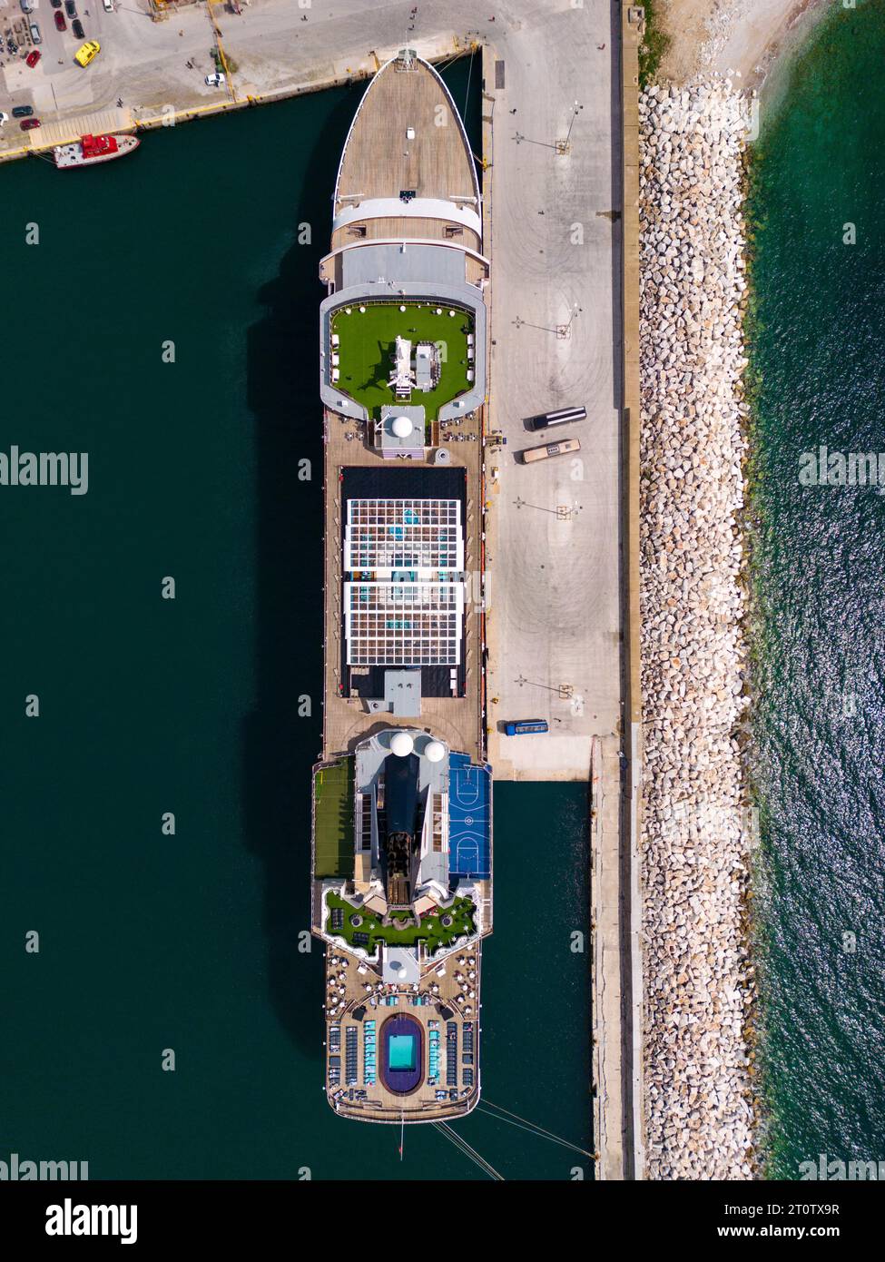 Taking in the stunning aerial view, a massive cruise ship sits docked ...