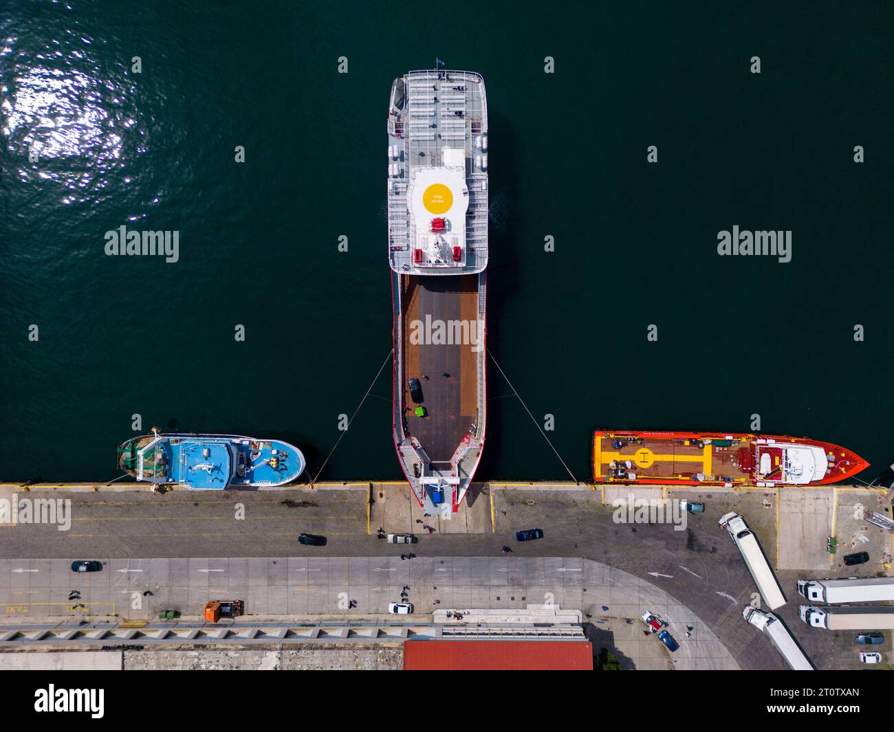 Aerial view of a ferry in the port. Ferry boats in the port provide a ...