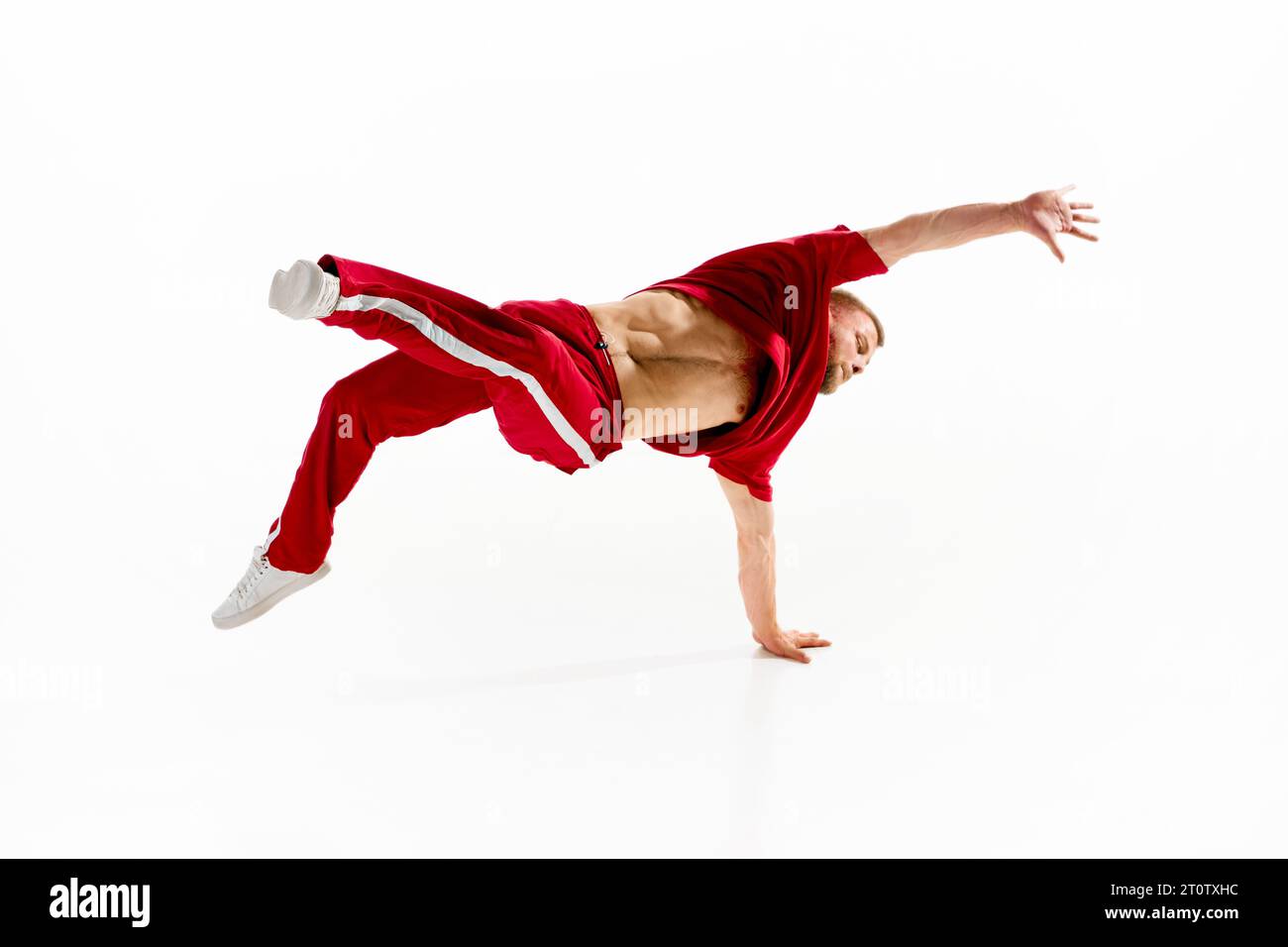 Fashionable portrait. Stylishly dressed man performing freestyle dance ...