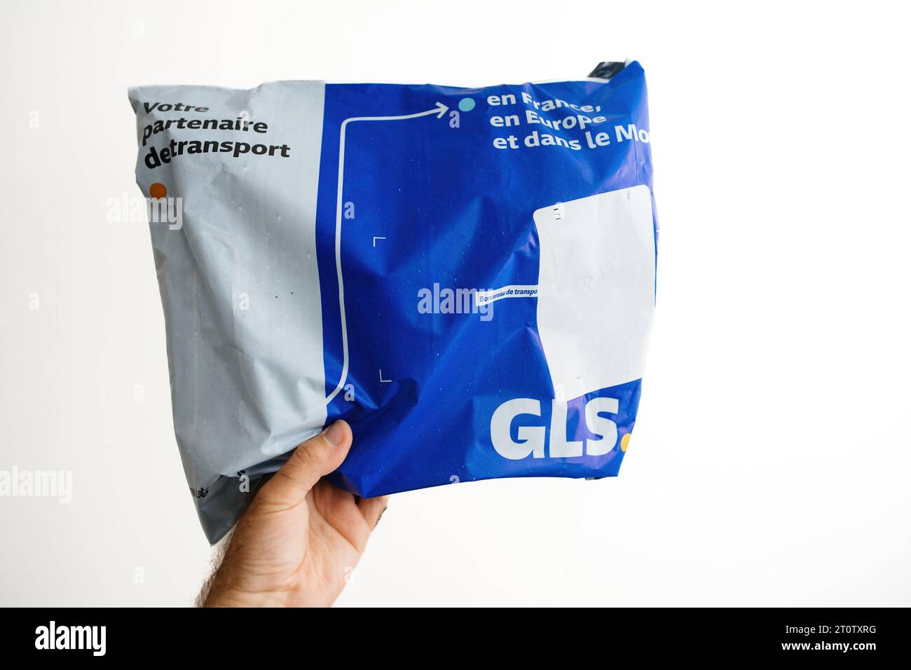 Paris, France - Sep 6, 2023: A male hand meticulously holds a GLS ...