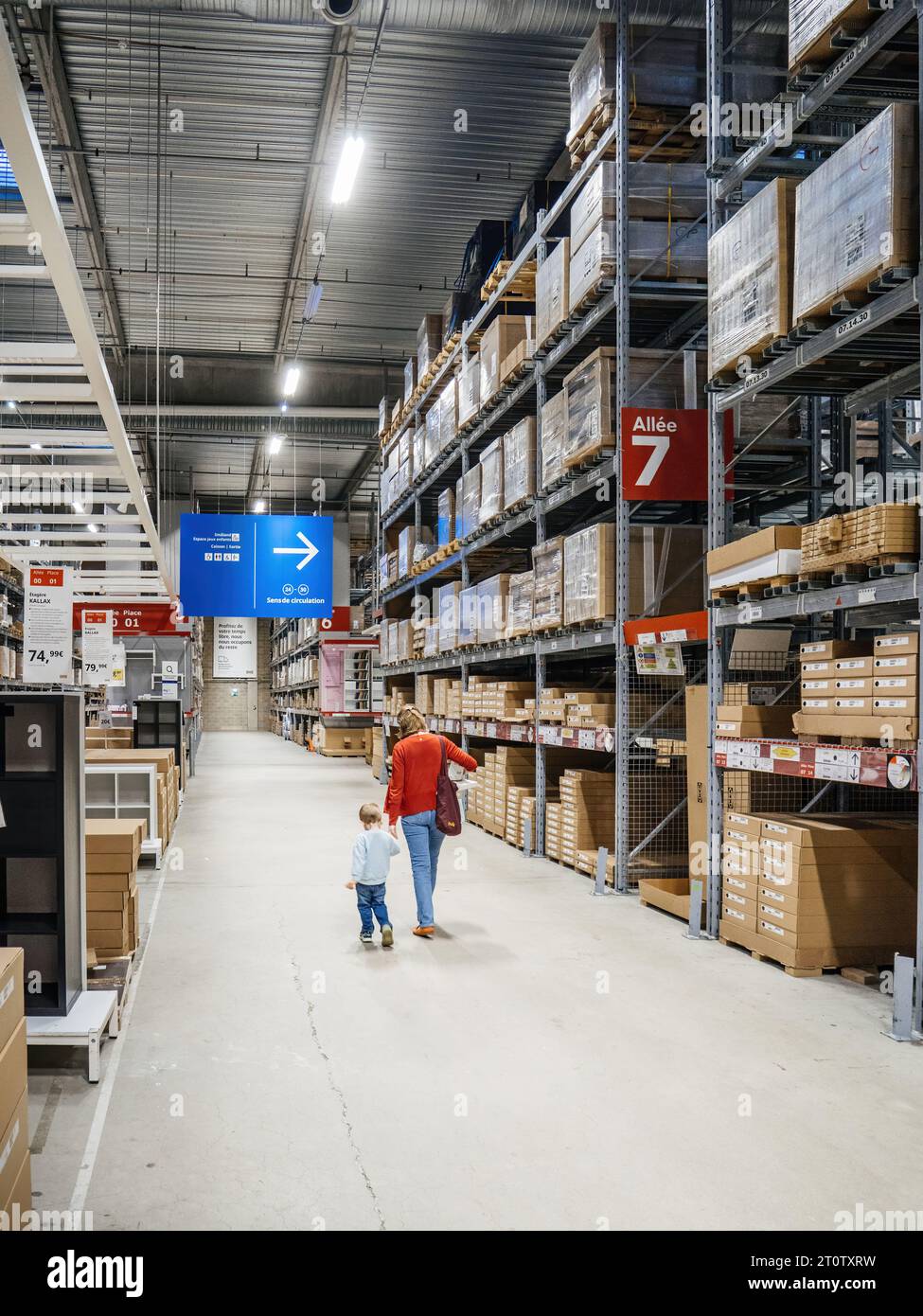 Paris, France - Aug 31, 2023: A mother and her toddler walk between ...