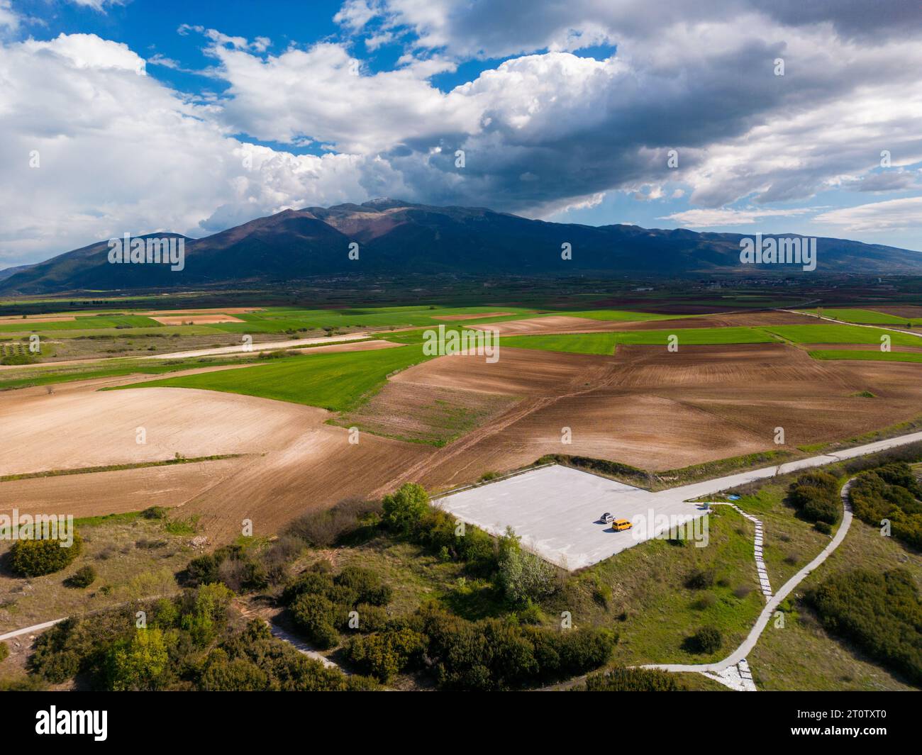 From above, the agricultural fields nestled amidst towering mountains ...