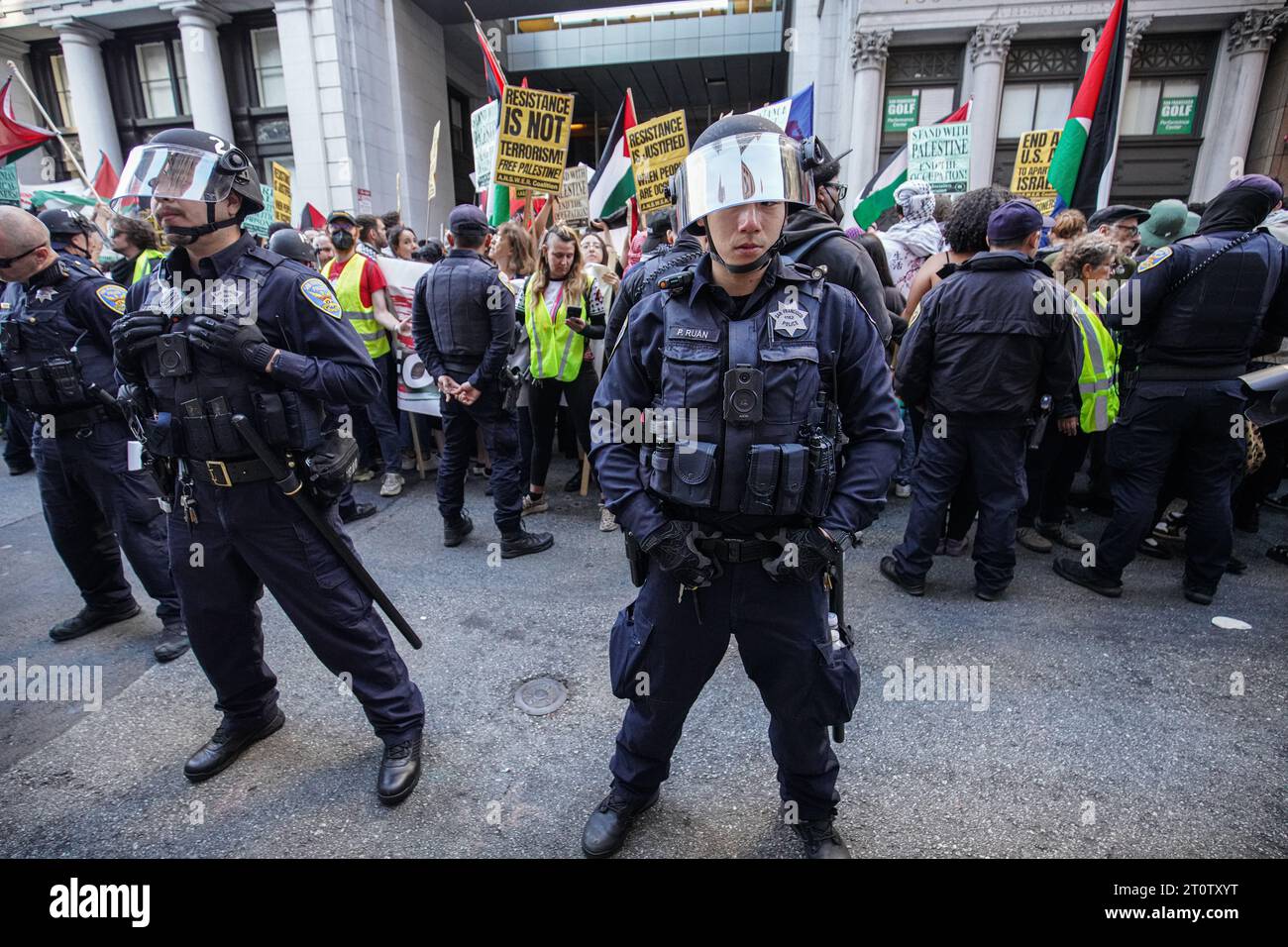 Riot policemen stand in front of the supporters of Palestine during the ...