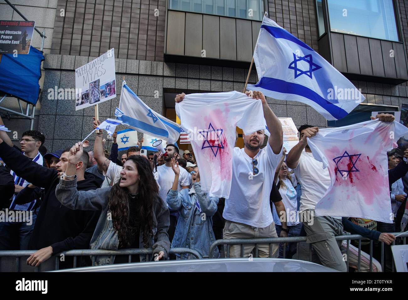 Supporters of Israel hold Israel flags and placards during the ...