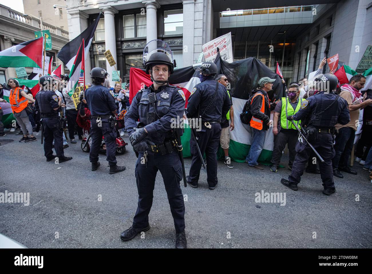 Riot policemen stand in front of the supporters of Palestine during the ...