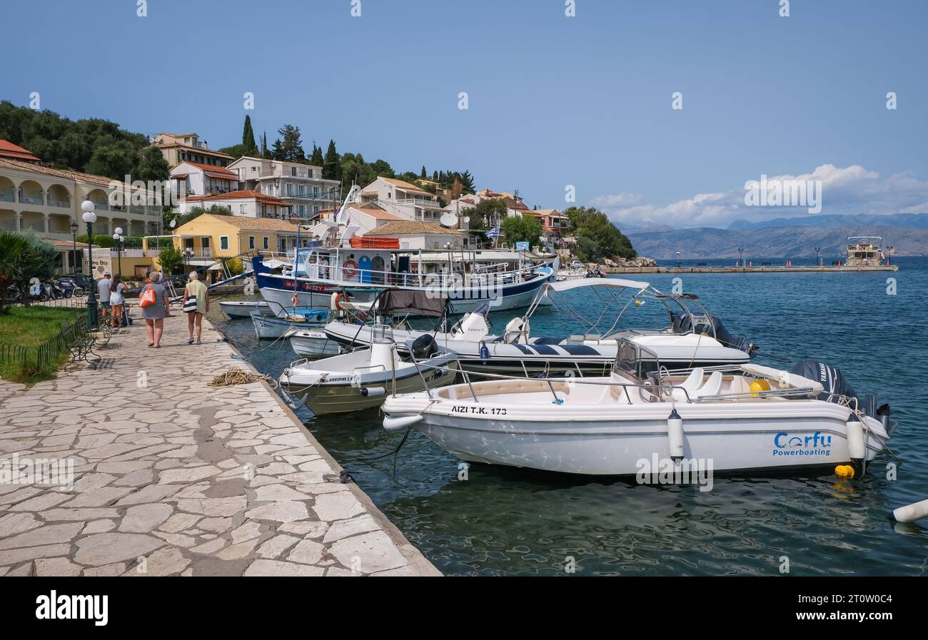 Kassiopi, Corfu, Greece - Fishing boats and an excursion boat in the ...