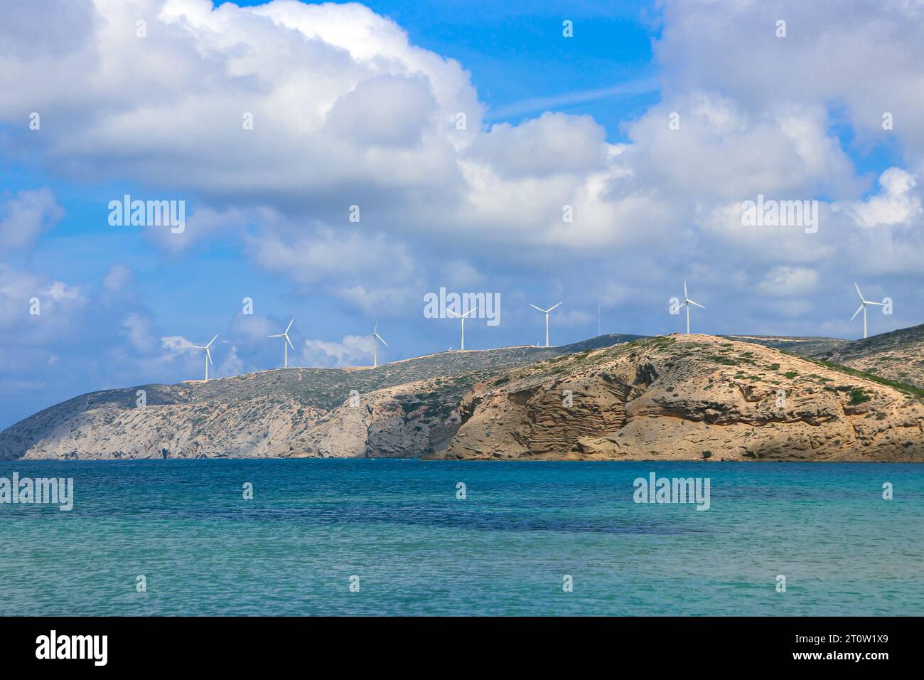 Windmills (Wind turbine) on a hill off Prasonisi Beach, Greece, a ...