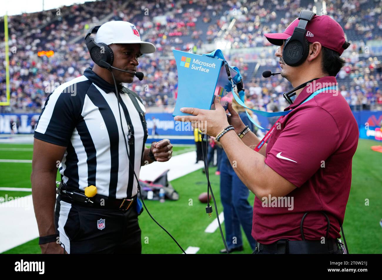 Referee Shawn Smith (14) tests the Microsoft Surface official review ...