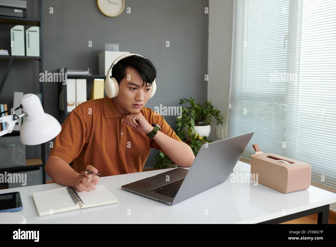 Confused student looking laptop screen hi-res stock photography and ...
