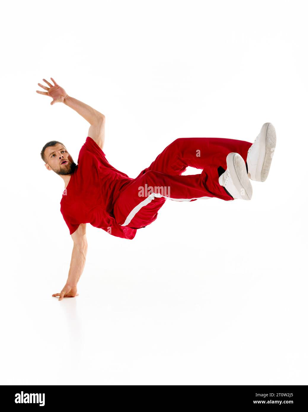 Air twist. Young sportive man, b-boy performing dance, hip-hop ...