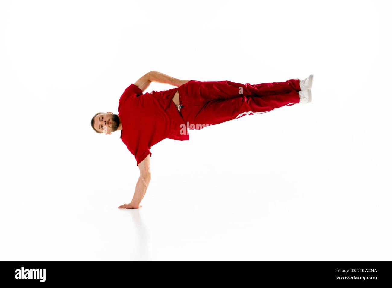 Air twist. Young sportive man, guy dancing hip-hop, breakdance elements ...