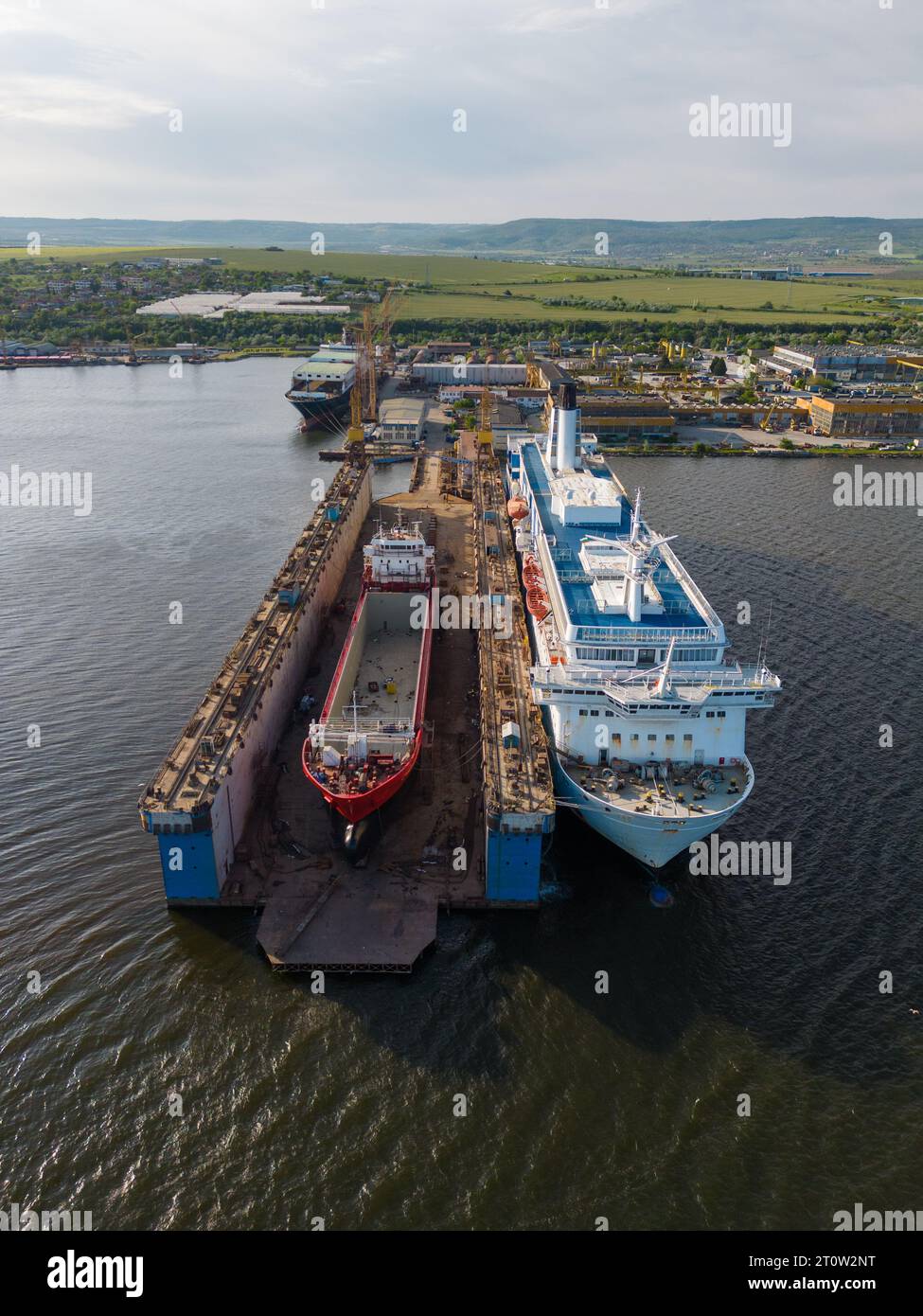 aerial top view shipyard dry dock maintenance and repair cargo ship ...