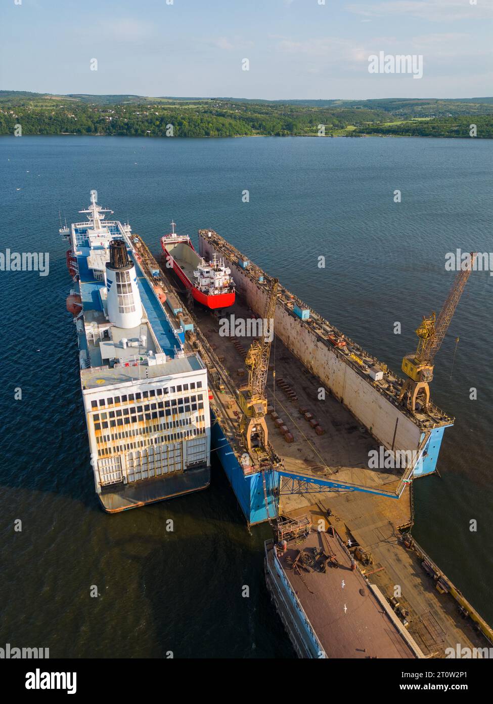 aerial top view shipyard dry dock maintenance and repair cargo ship ...