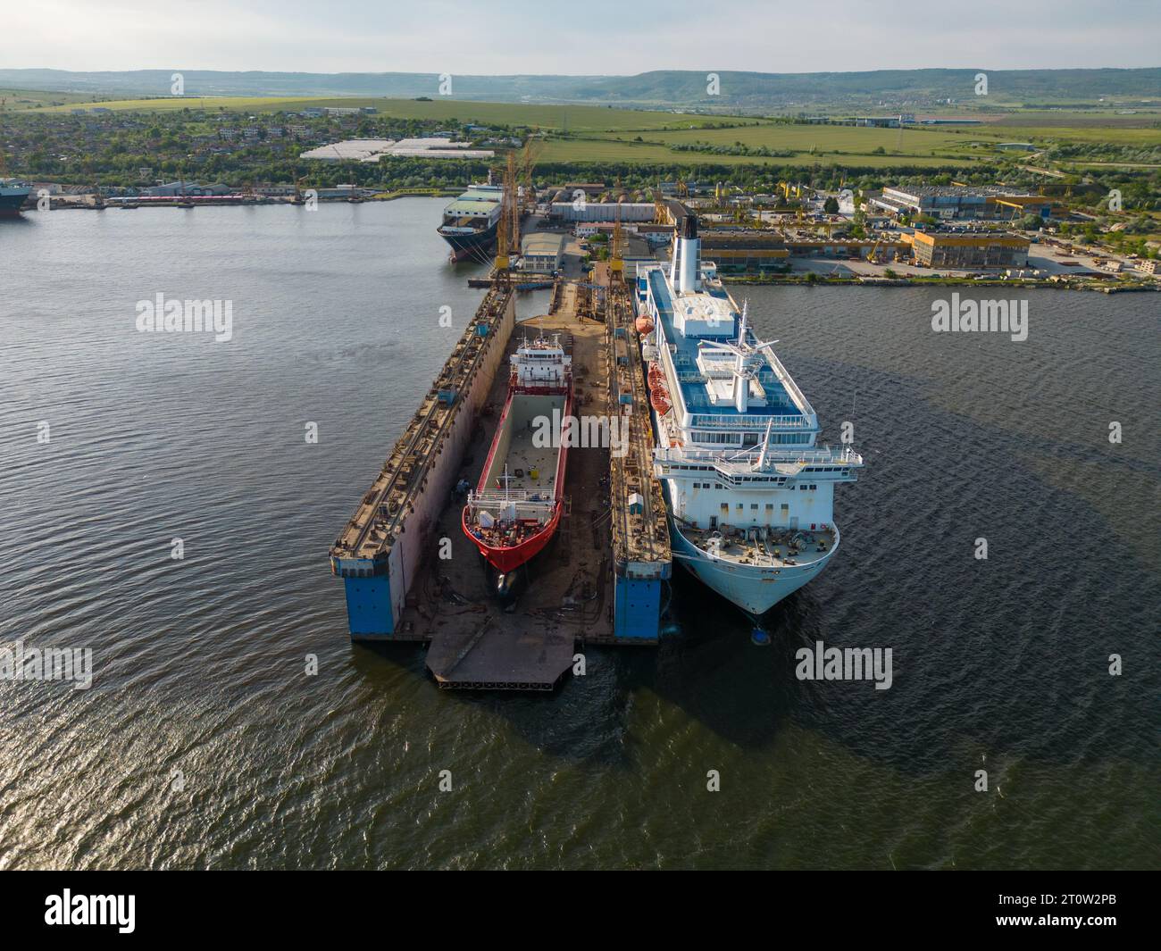 aerial top view shipyard dry dock maintenance and repair cargo ship ...