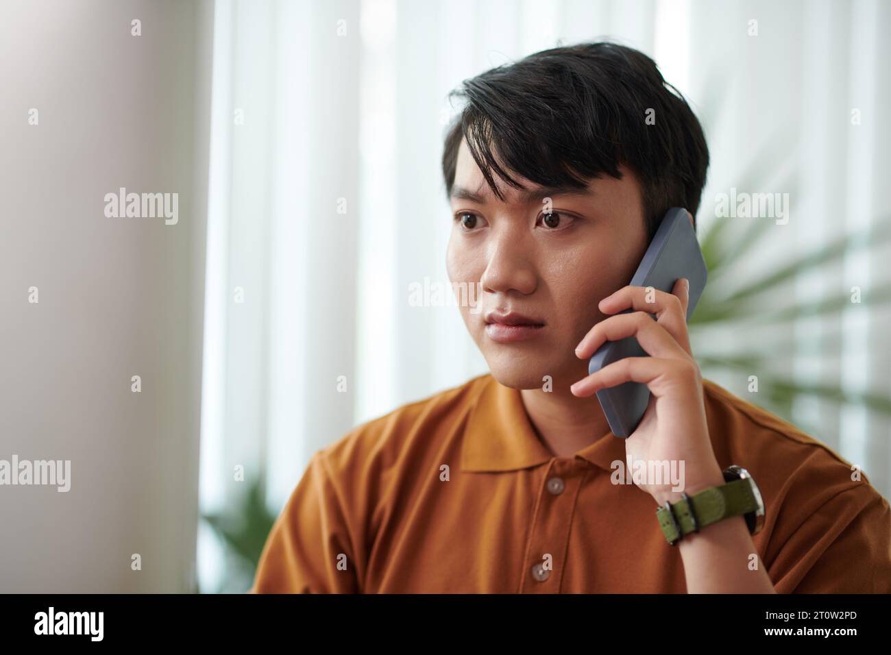 Worried developer calling coworker calling system administrator Stock ...