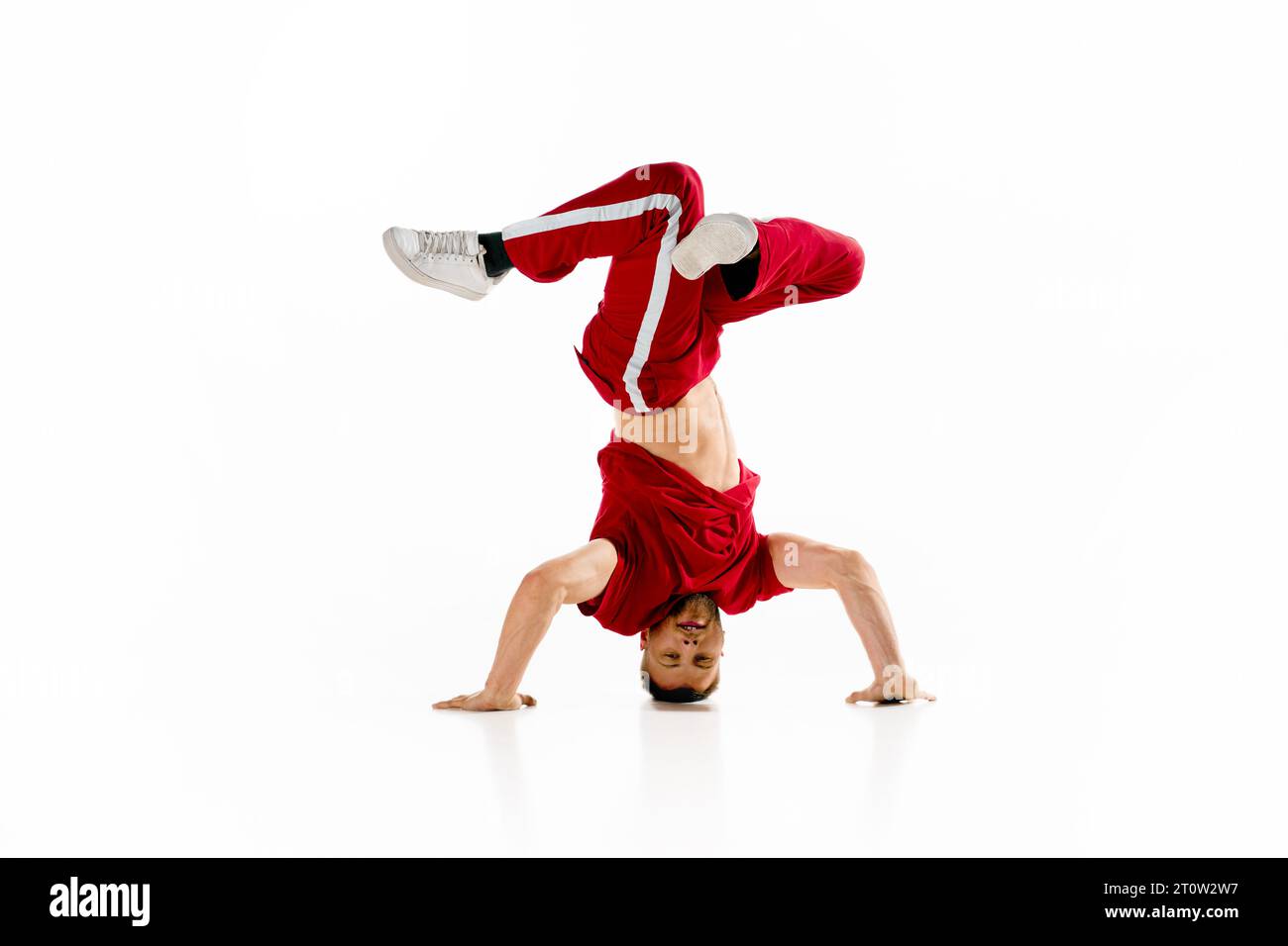 Headspin. Stylishly dressed man dancing breakdance, freestyle elements ...