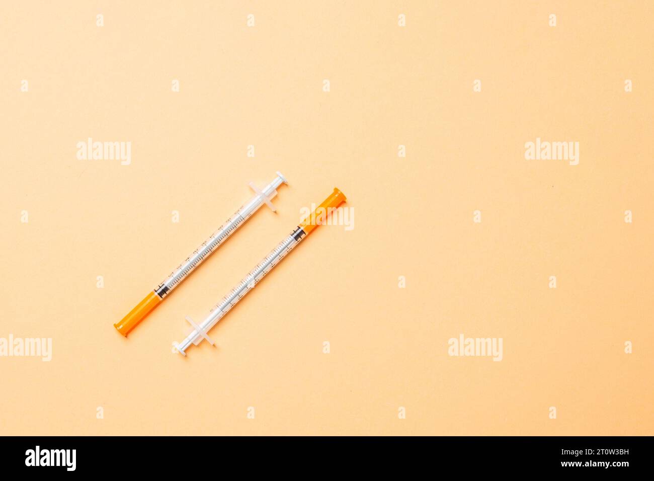 Top view of insulin syringes ready for injection on colorful background ...