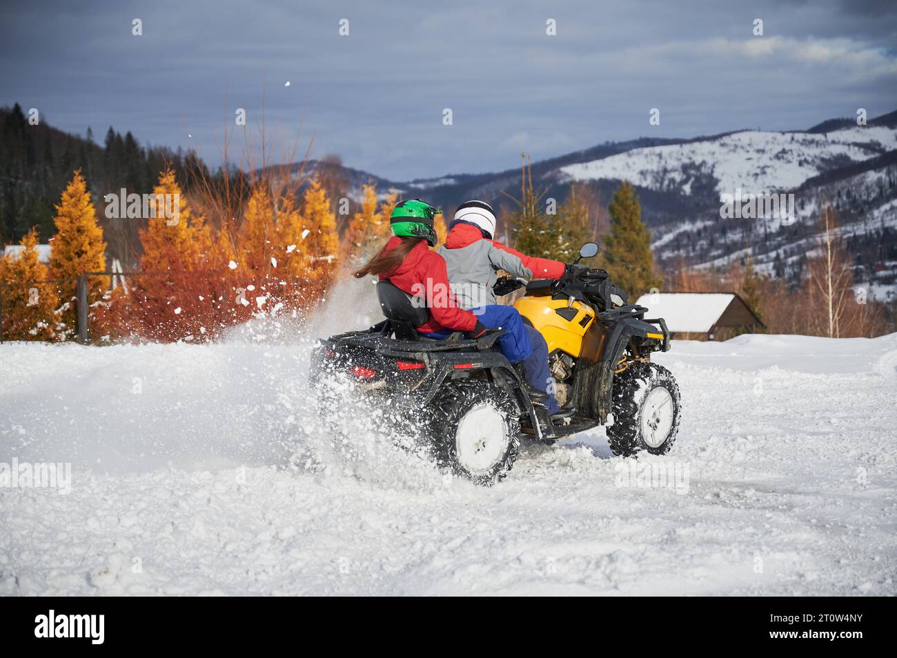 Portrait of man and woman riding on offroad four-wheeler ATV. Concept ...
