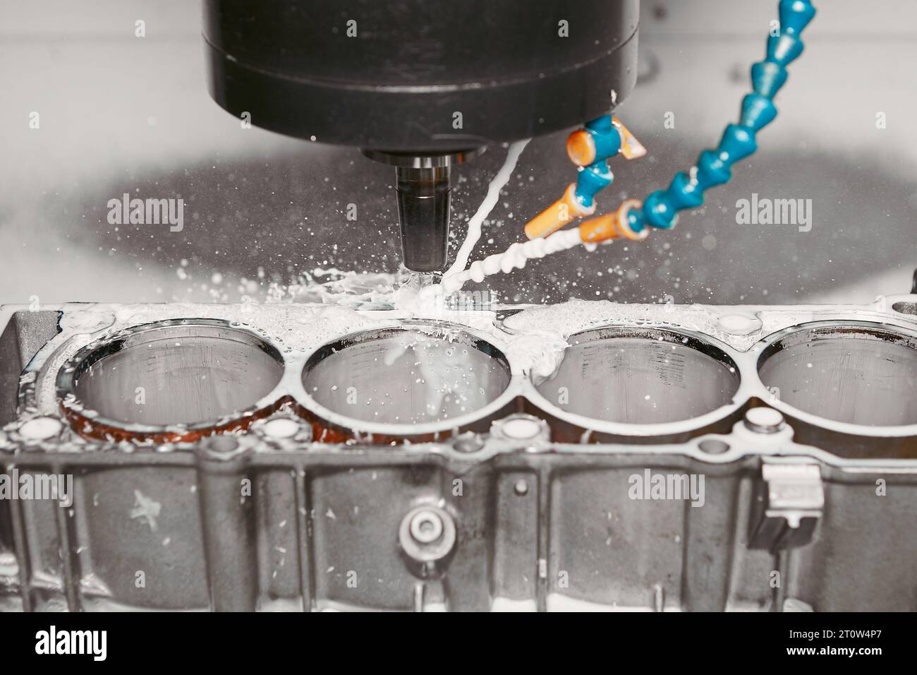 High precision cnc milling machine makes holes in the car engine Stock ...