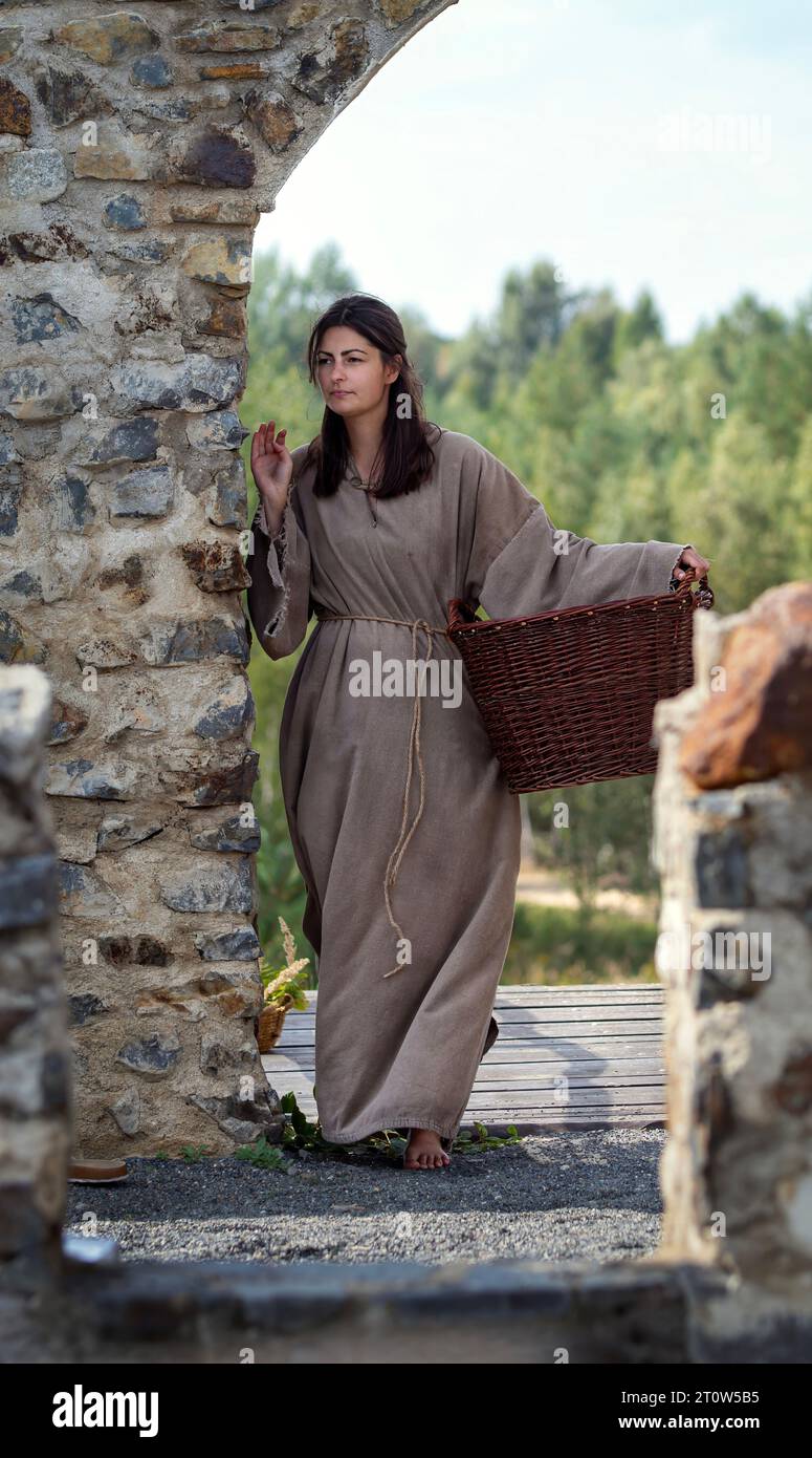 Medieval maid stands at the entrance to a castle Stock Photo - Alamy