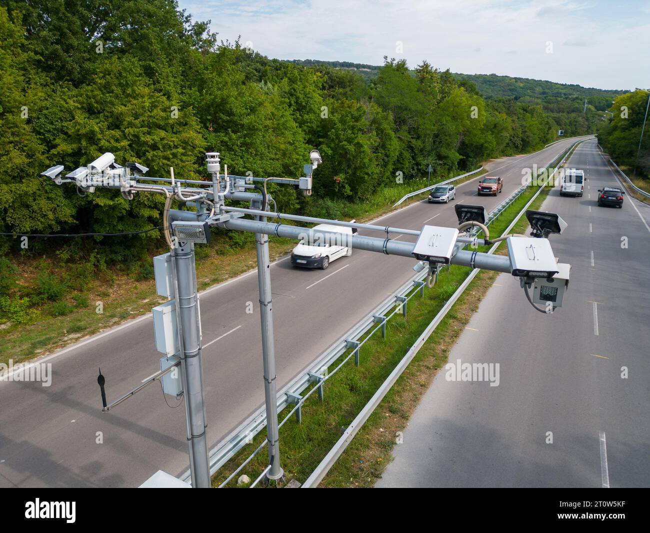 Cameras and speed control radars along a busy highway monitor and ...
