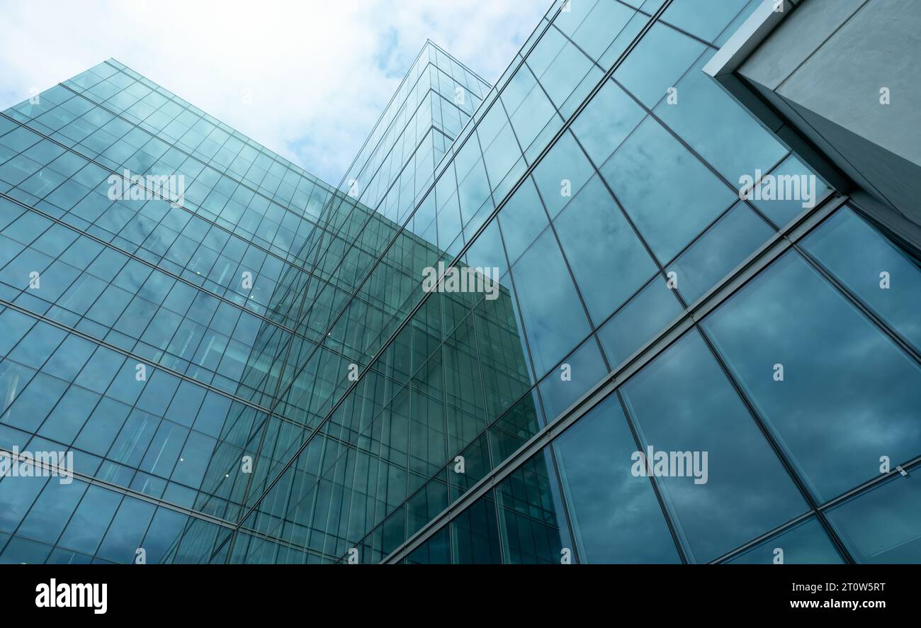 Modern sustainable glass office building. Exterior view of corporate ...