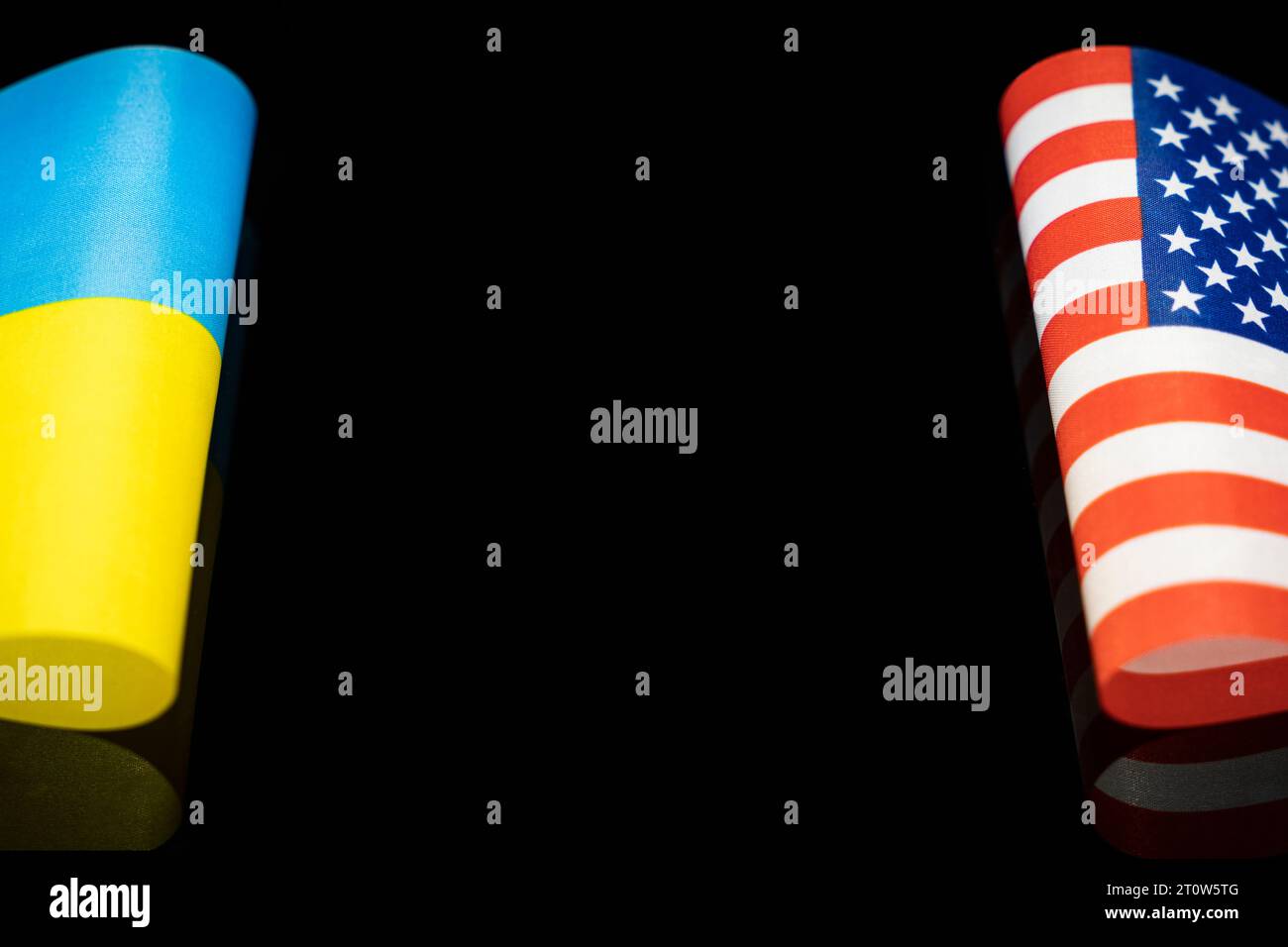 flags of USA and ukraine on a black background. The concept of ...