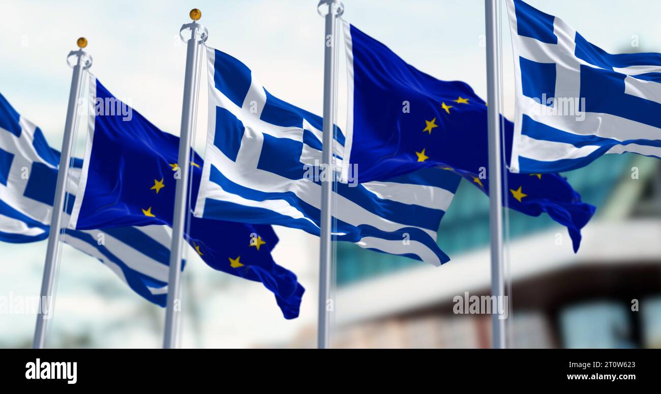 National flags of Greece waving in the wind with flags of the European ...