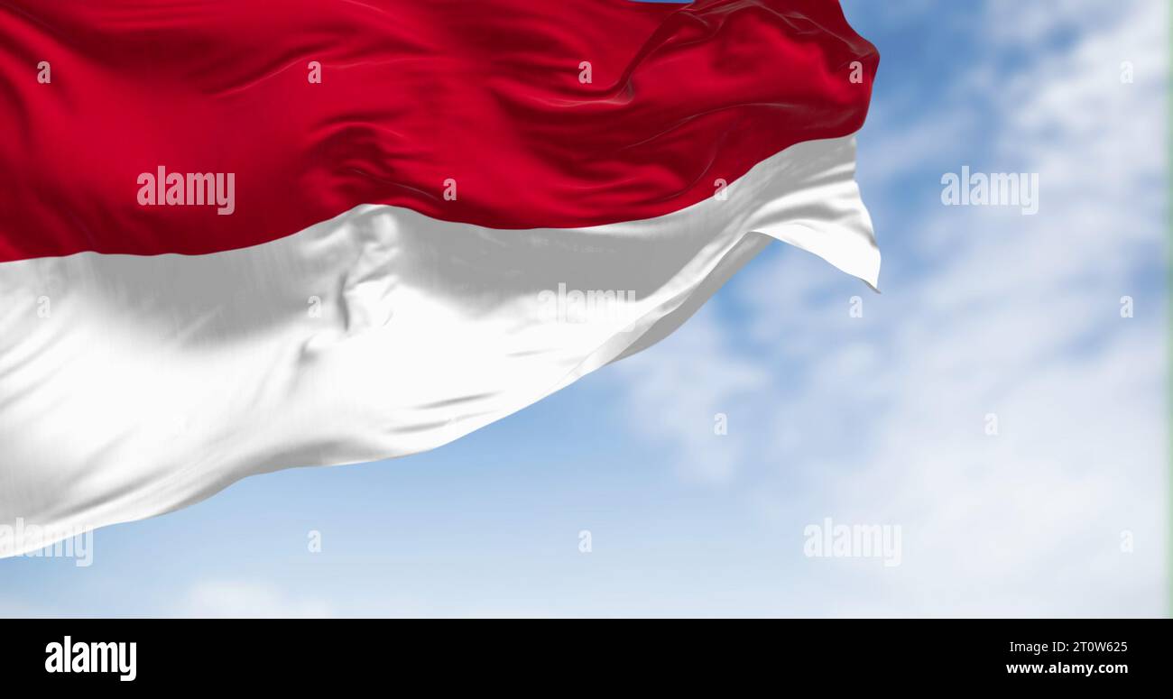 Indonesia national flag waving in the wind on a clear day. Two ...