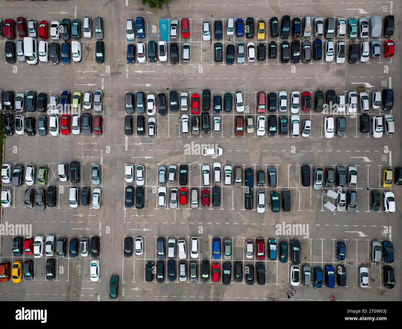 Drone's aerial view reveals a densely packed parking lot filled with ...