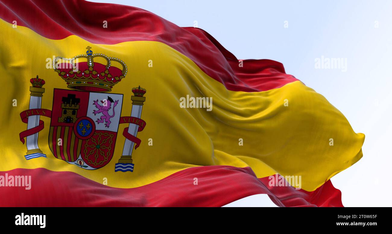 Kingdom of Spain national flag waving in the wind. Red, yellow, red ...