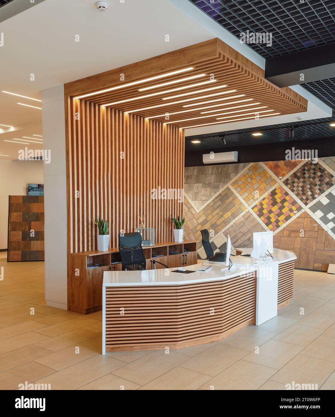 Reception with ceiling lights for small shop, showroom Stock Photo - Alamy