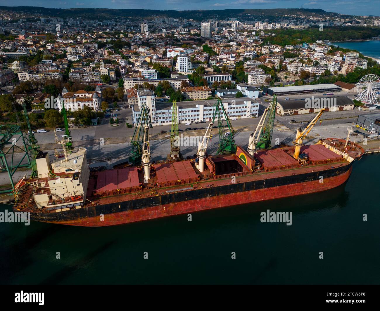 cargo ship or bulk carrier loaded to the brim with grain is preparing ...
