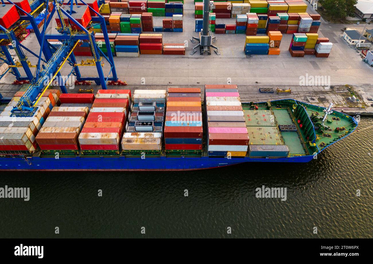 aerial view of a container ship in terminal at the port, where massive ...