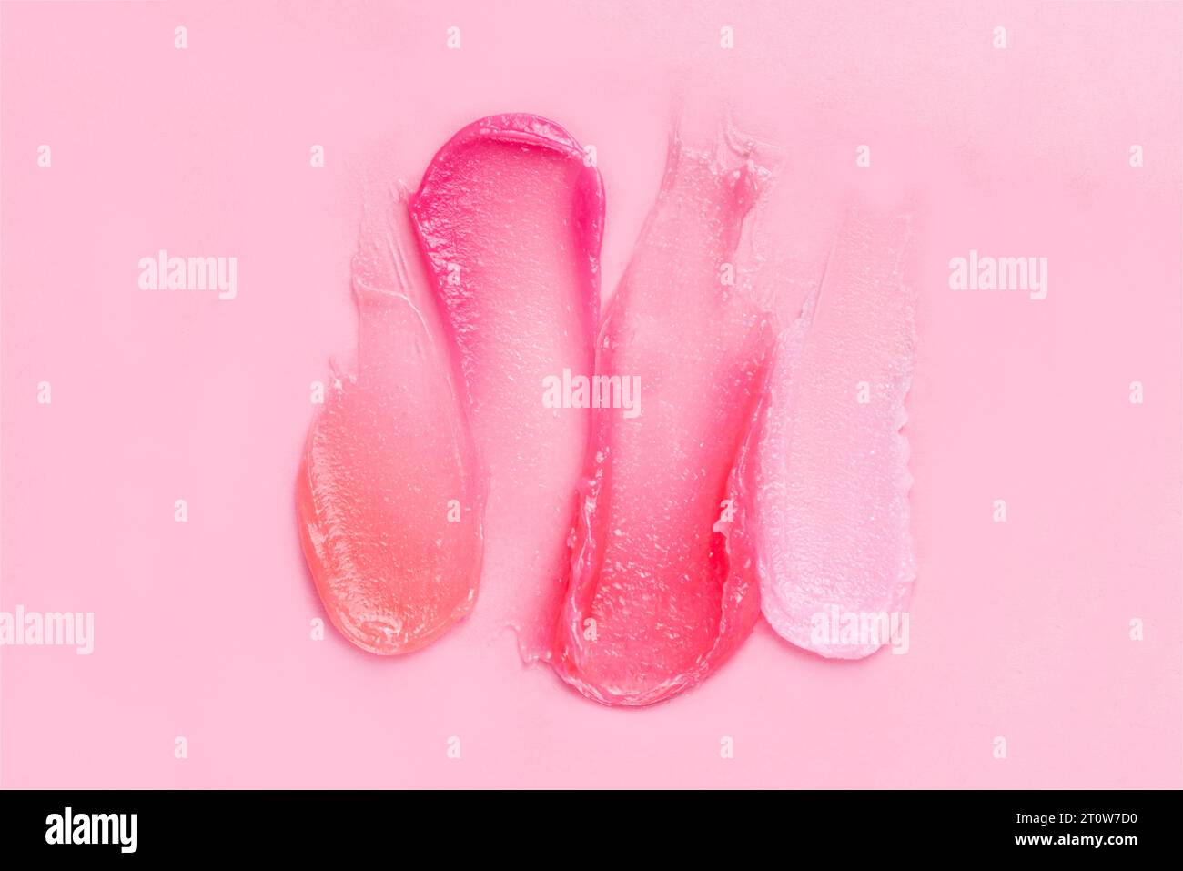 Set with make up cosmetics swatches ipstick, lip gloss on white ...