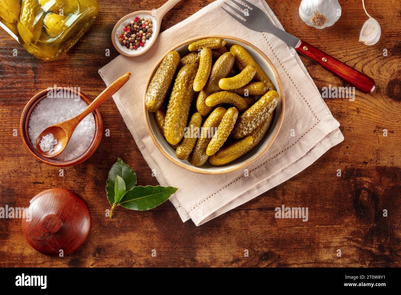 Pickled cucumbers with salt, pepper, garlic, and bay leaf. Fermented ...