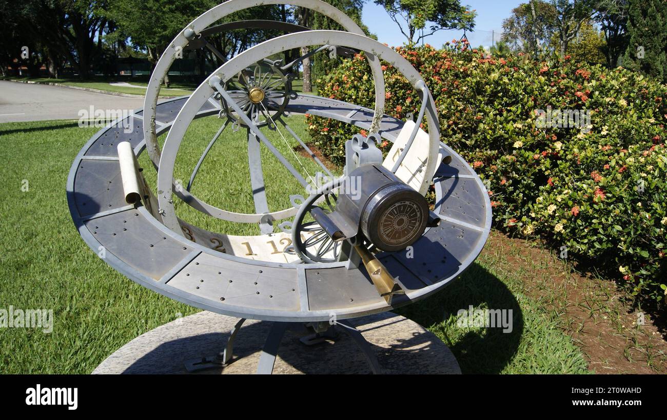Sundial built in resort lawn garden with colorful plants and flowers ...
