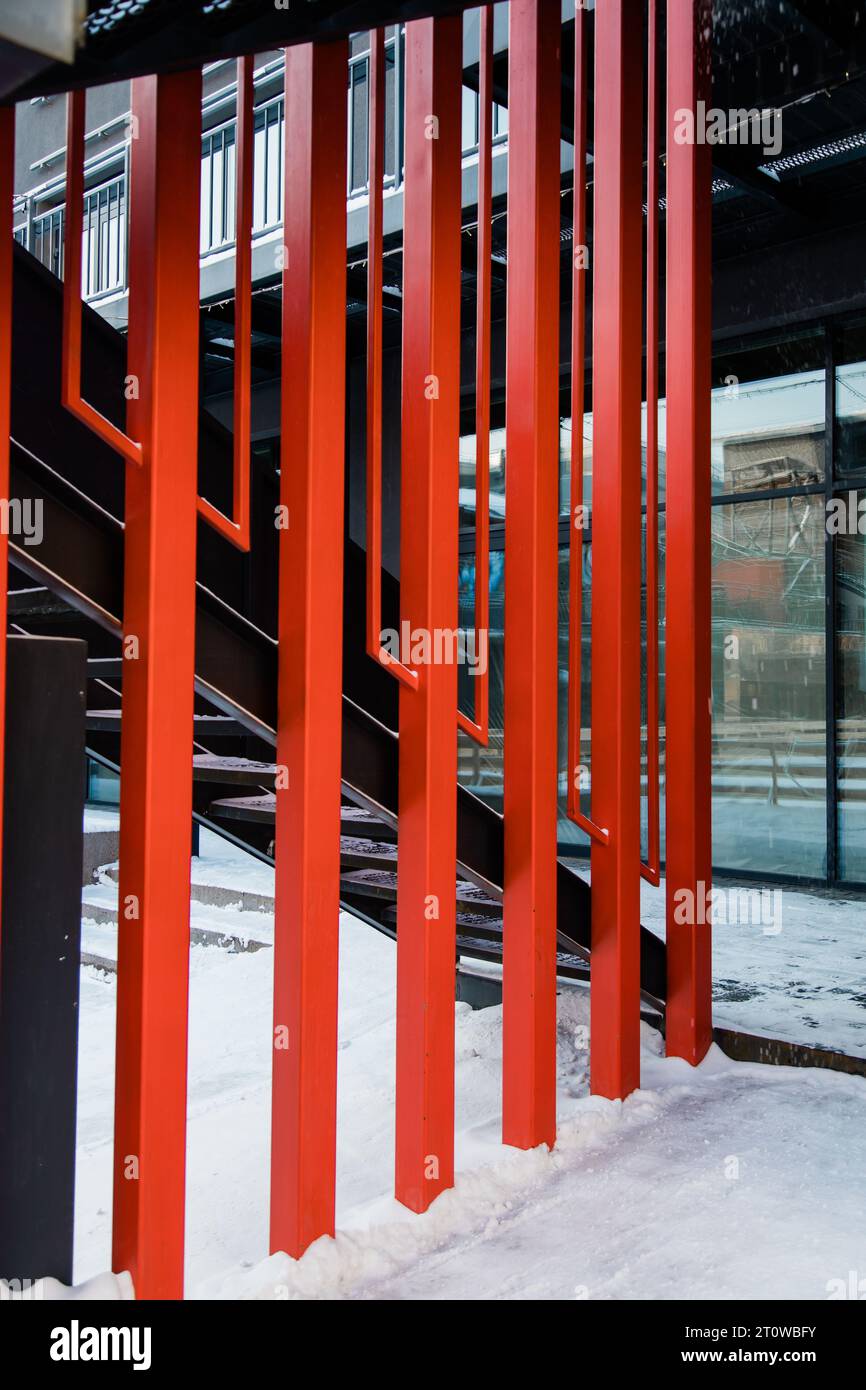 Fire escape ladder or emergency exit with steel staircase on wall of ...