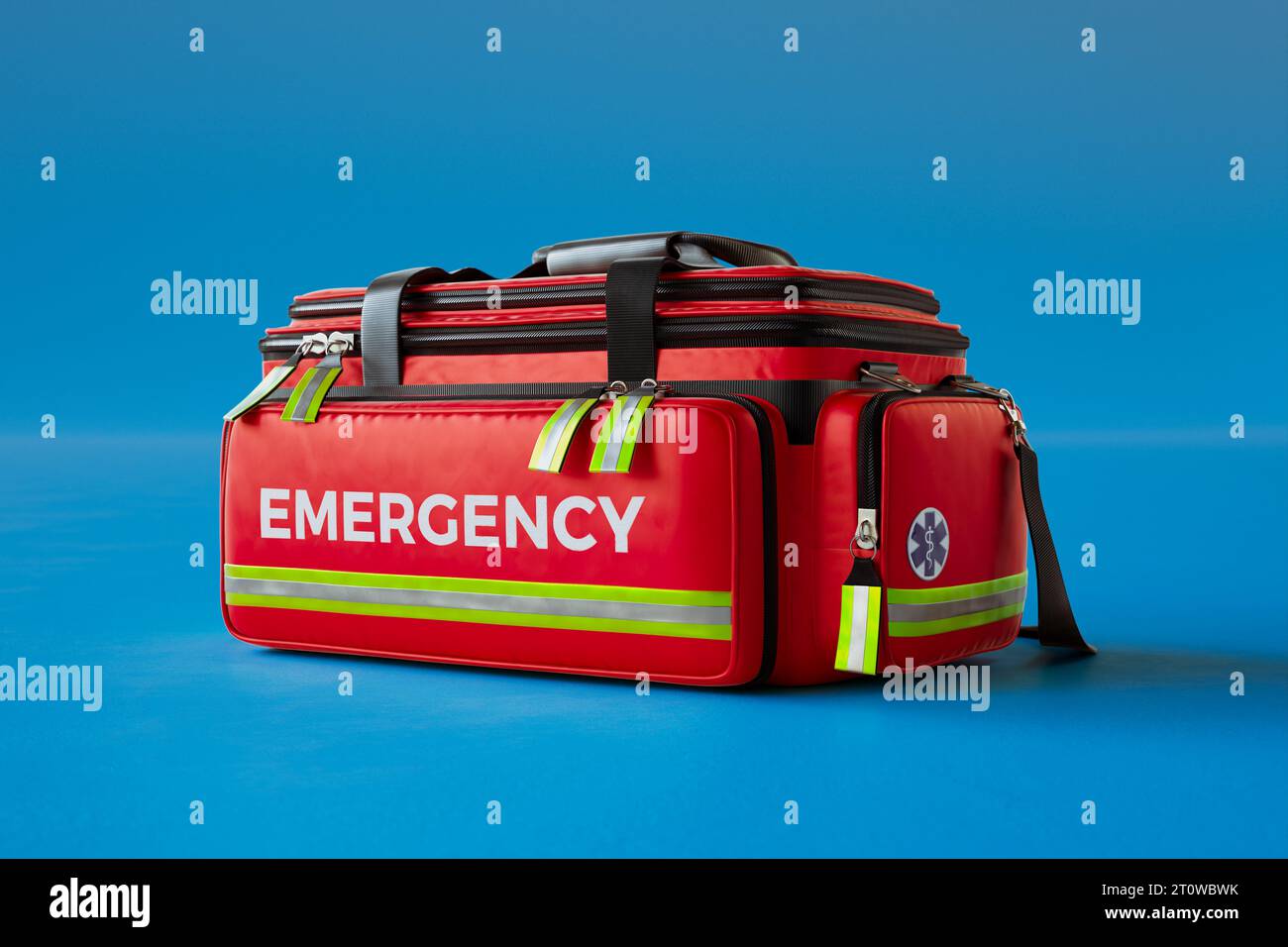 A professional red emergency first aid bag in simple studio light ...