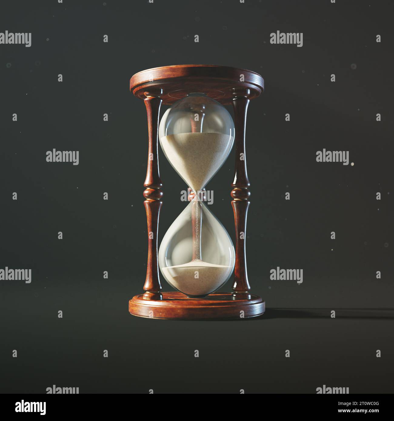 A picture of the wooden retro hourglass with falling sand inside a ...
