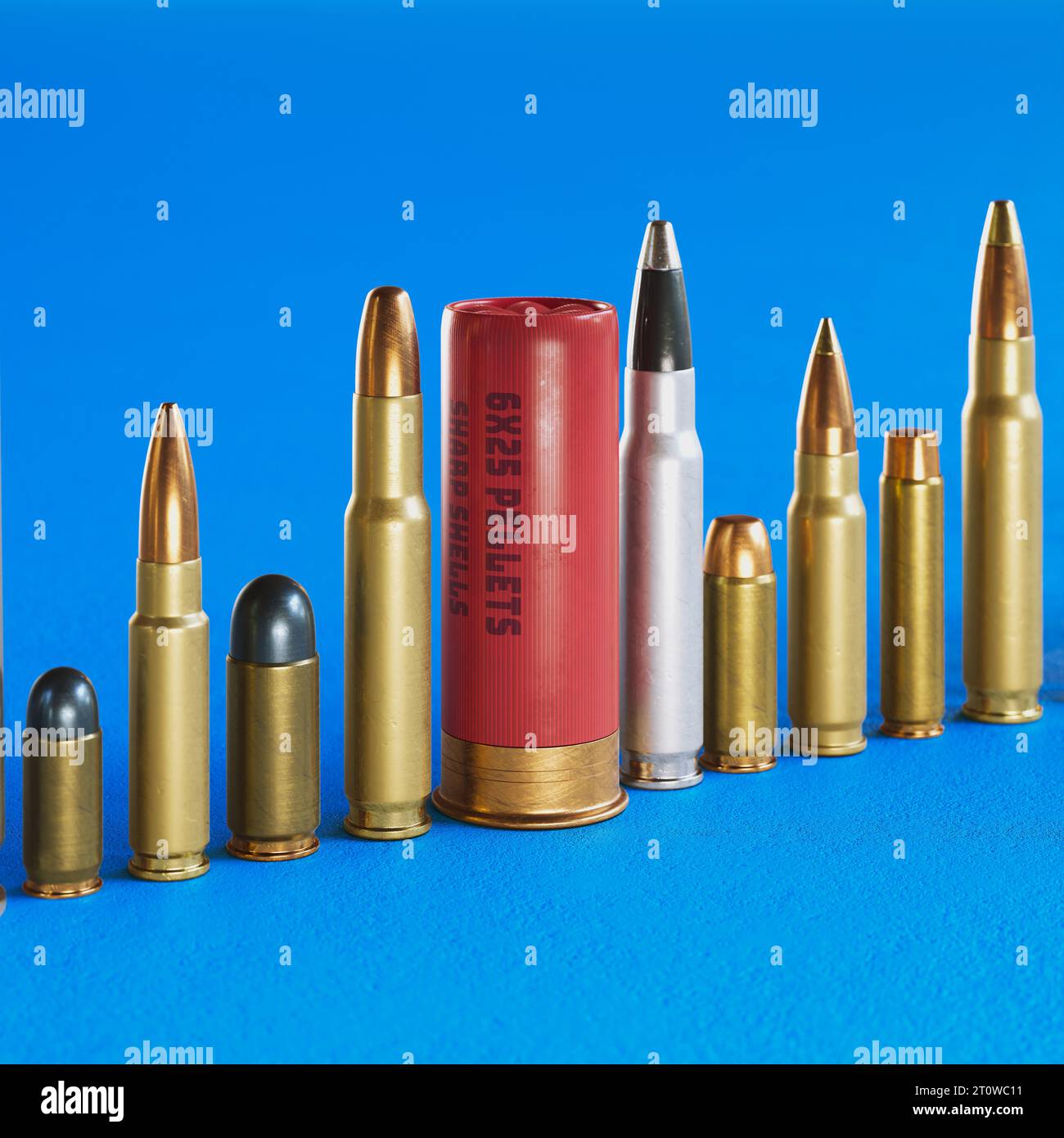 A huge row of different bullet types standing on the concrete floor ...