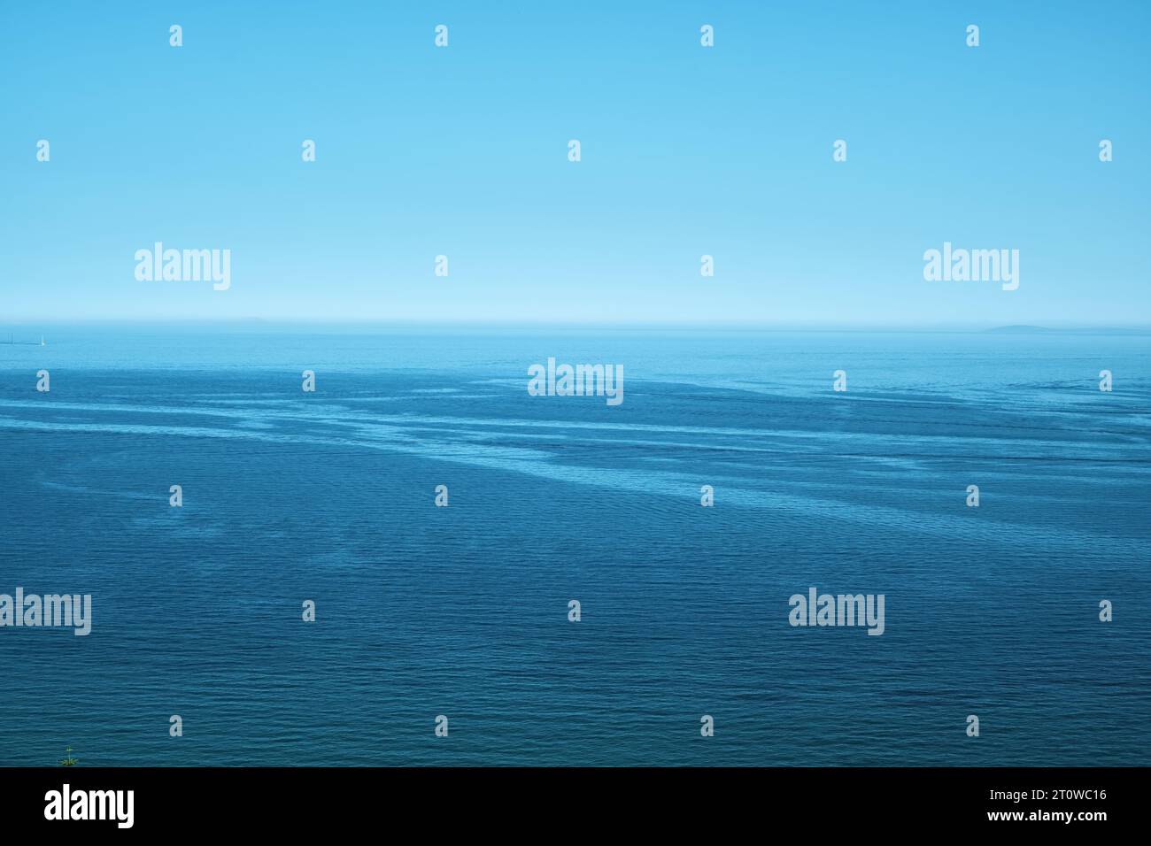 Dark blue water from the sea with blue sky. Vertical format, also ...