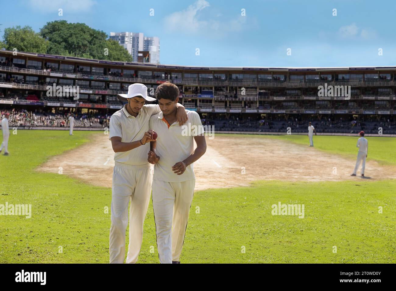 Captain advising the bowler, as they walk to the run up of the bowler ...